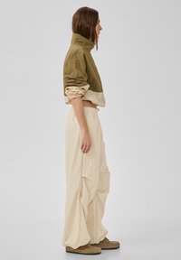 My Essential Wardrobe QUINN TRACK - Trousers - brown rice/light yellow ...