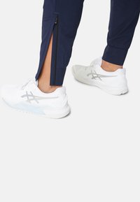 ASICS MATCH - Tracksuit bottoms - midnight/dark blue - Zalando.co.uk