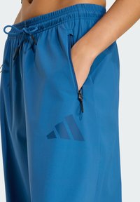 adidas Sportswear Z.N.E. - Tracksuit bottoms - dusky petrol/teal - Zalando