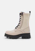 Calvin Klein Jeans CHUNKY COMBAT LACEUP ZIP - Platform ankle boots ...