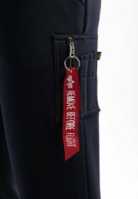 Alpha Industries NASA JOGGER - Tracksuit bottoms - black - Zalando