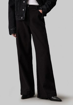 Calvin Klein Performance RELAXED WIDE LEG JOGGERS - Jogginghose - black ...