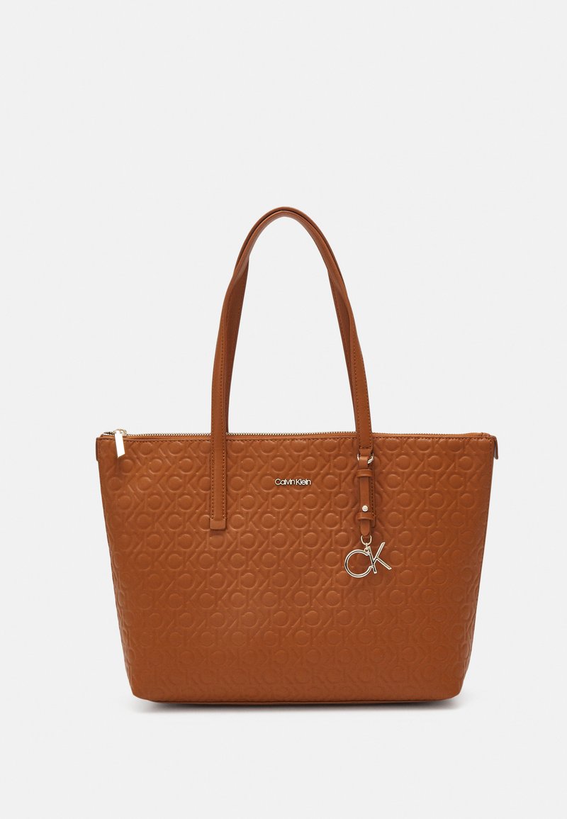 Calvin Klein MUST EMBOSSED MONO - Handbag - cognac - Zalando.co.uk