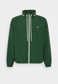 Lacoste Lichte jas - vert/groen - Zalando.nl