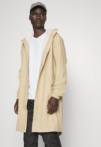 Rains FISHTAIL UNISEX - Impermeabile - sand/beige - Zalando.it