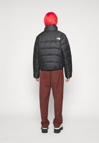 The North Face Winterjas - black/zwart - (Pre-owned) - Zalando.nl