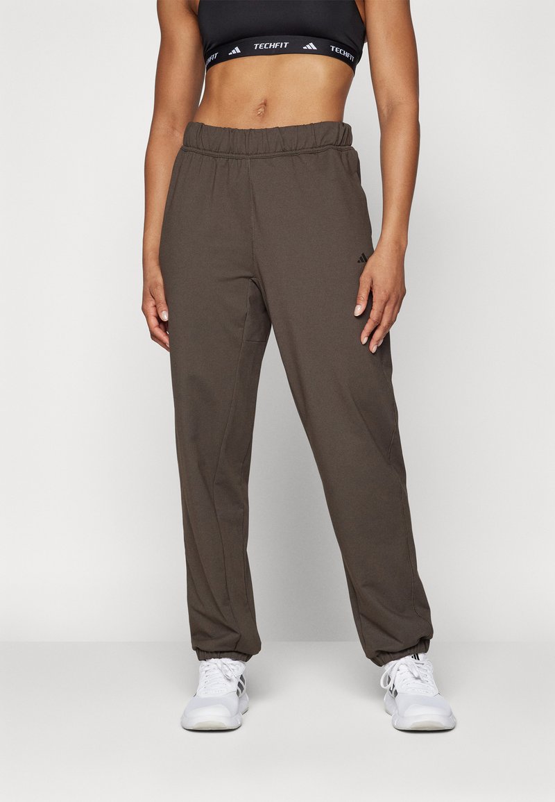 adidas Performance POWER LOOSE FIT - Tracksuit bottoms - shadow olive ...