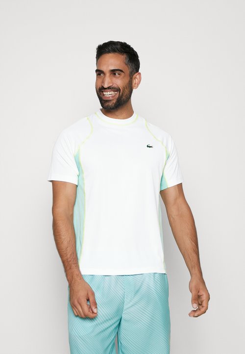 Lacoste Sport TENNIS TOUR - Poloskjorter - white/pastille mint lima ...