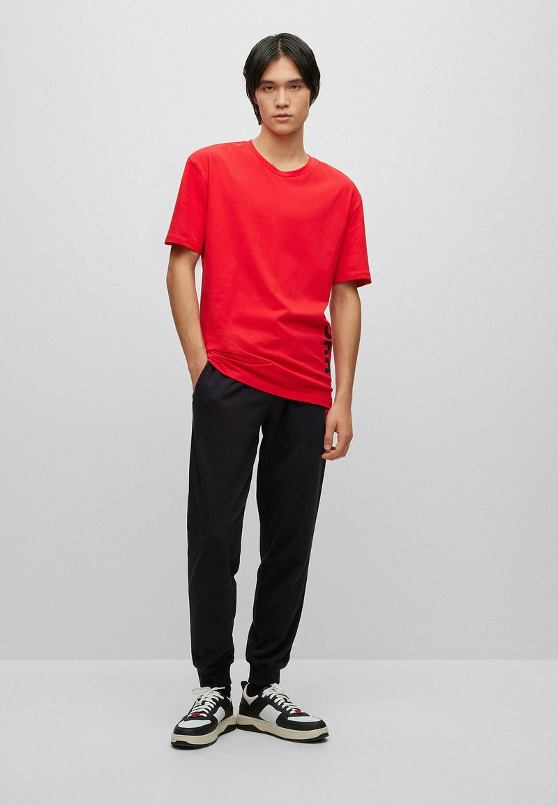 HUGO CUT LOGO - Pantalon de survêtement - black one/noir - ZALANDO.CH