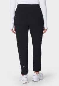Sweaty Betty EXPLORER 27 - Tracksuit bottoms - black/mottled black ...