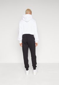 Diesel Tracksuit bottoms - black - Zalando.co.uk