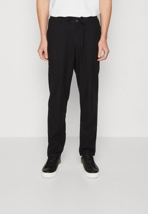 Weekday KEN TRACKPANTS UNISEX - Pantalones - black/negro - Zalando.es