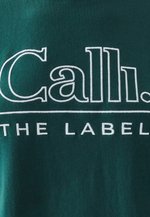 CALLI THE LABEL - T-Shirt print - emerald white logo/dunkelgrün ...