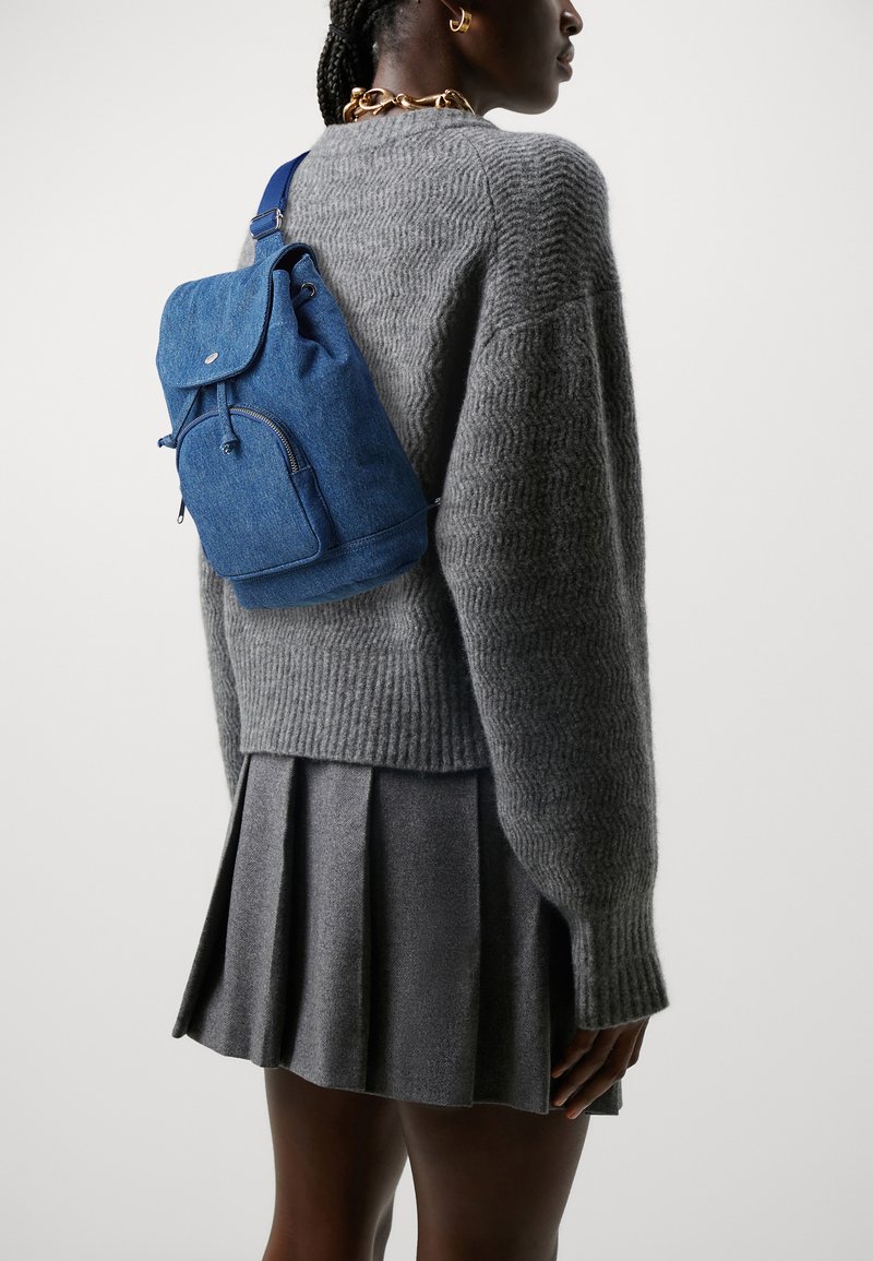 Levi's® WOMENS SLING BAG - Rucksack - light blue/blue denim - Zalando.ie