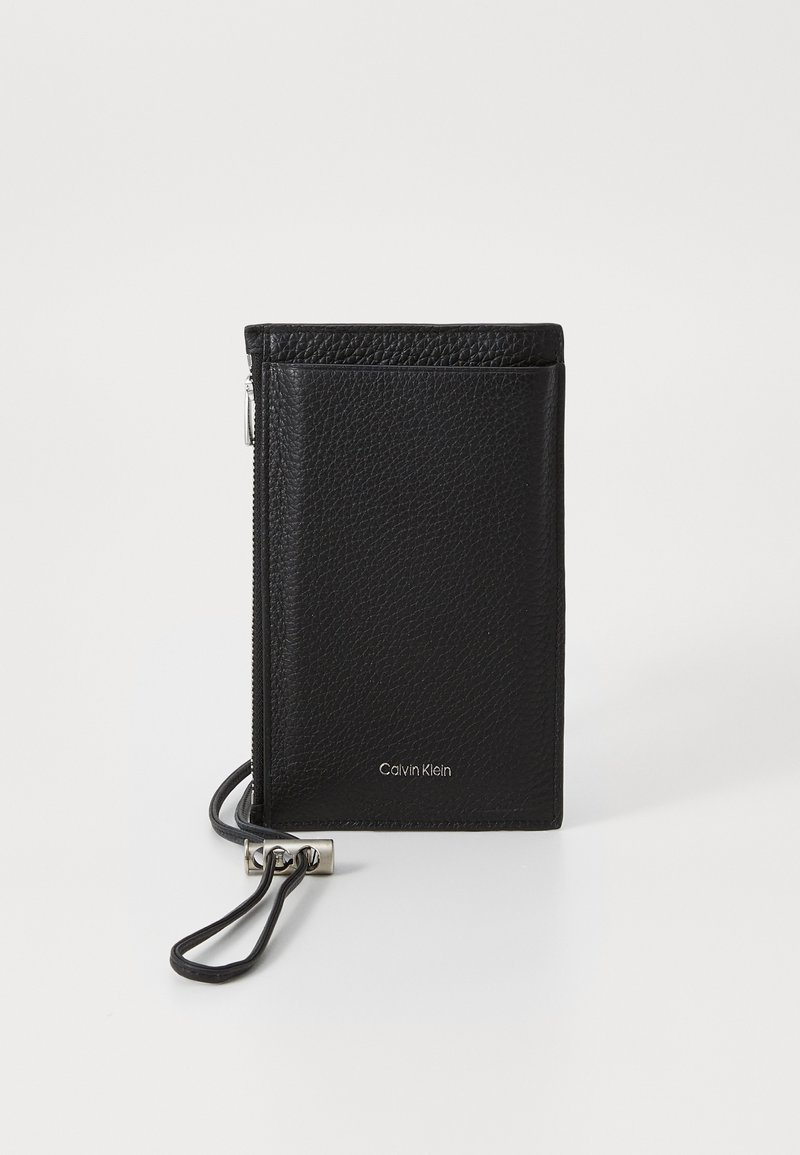 Calvin Klein EMBOSS PHONE CROSSBODY - Phone pouch - black - Zalando.co.uk