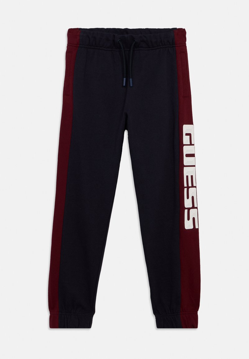 Guess JUNIOR REGULAR - Tracksuit bottoms - smart blue/dark blue ...