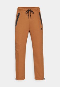 Nike Sportswear TECH FLEECE OPEN HEM PANT - Tepláky - lt british tan ...