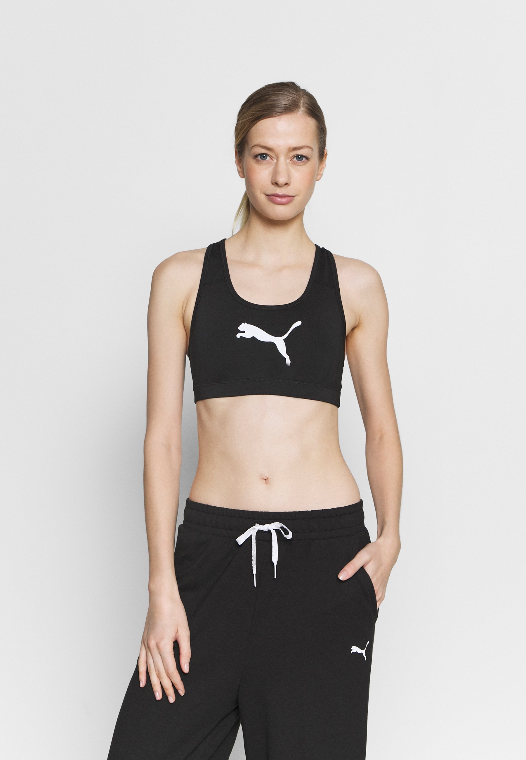 Puma IMPACT 4KEEPS - Sport-BH mit mittlerer Stützkraft - black/schwarz ...