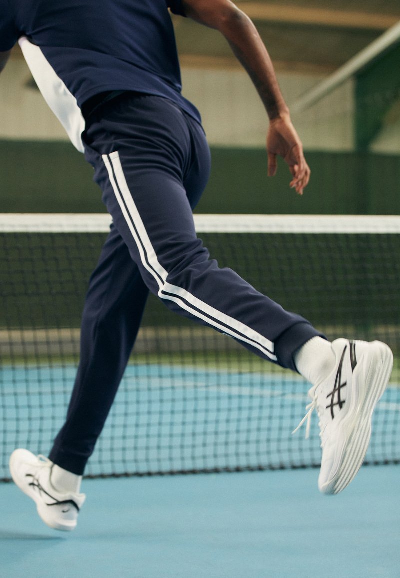 Sergio Tacchini NEW YOUNG LINE PANTS - Tracksuit bottoms - navy/white ...