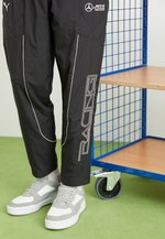 Puma GARAGE PANTS - Tracksuit bottoms - black - Zalando.co.uk