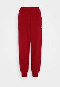 Puma RELAXED SWEATPANTS - Träningsbyxor - intense red/röd - Zalando.se
