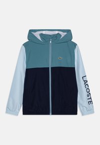 Lacoste WATER REPELLENT TAFFETA UNISEX - Waterproof jacket - limestone ...