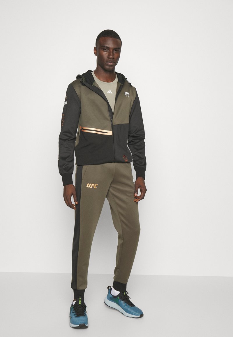 Venum UFC FIGHT WEEK ADRENALINE - Tracksuit bottoms - khaki/bronze ...