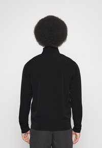 Puma STUDIO ULTRAMOVE JACKET - Trainingsjacke - black/schwarz - Zalando.ch