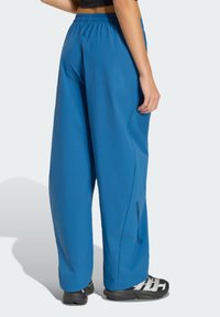 adidas Sportswear Z.N.E. - Tracksuit bottoms - dusky petrol/teal - Zalando