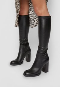 Minelli High heeled boots - black - (Pre-owned) - Zalando