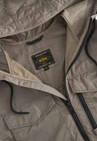 Next SHOWER RESISTANT HOODED SHACKET - Veste légère - stone natural ...