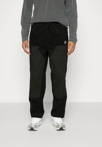 Puma DOWNTOWN PANTS - Trousers - black - Zalando.co.uk