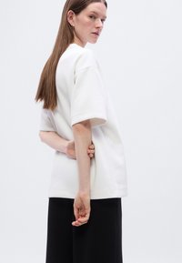 Lacoste Tracksuit bottoms - black - Zalando.ie