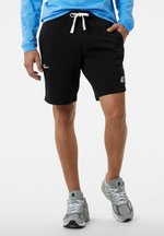 New Balance NB ESSENTIALS - Tracksuit bottoms - black/anthracite ...
