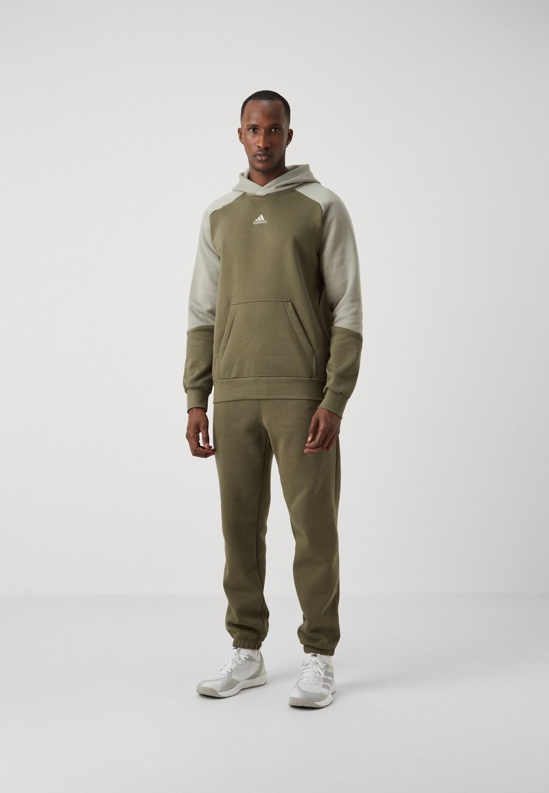 adidas Sportswear BLOCK - Tracksuit - olive strata/silver pebble/olive ...