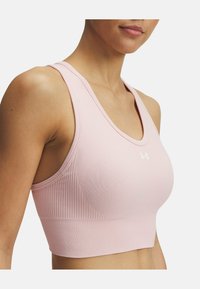 Under Armour VANISH SEAMLESS - Medium support sports bra - prime pink ...