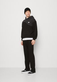 Night Addict Jogginghose - black/schwarz - Zalando.ch