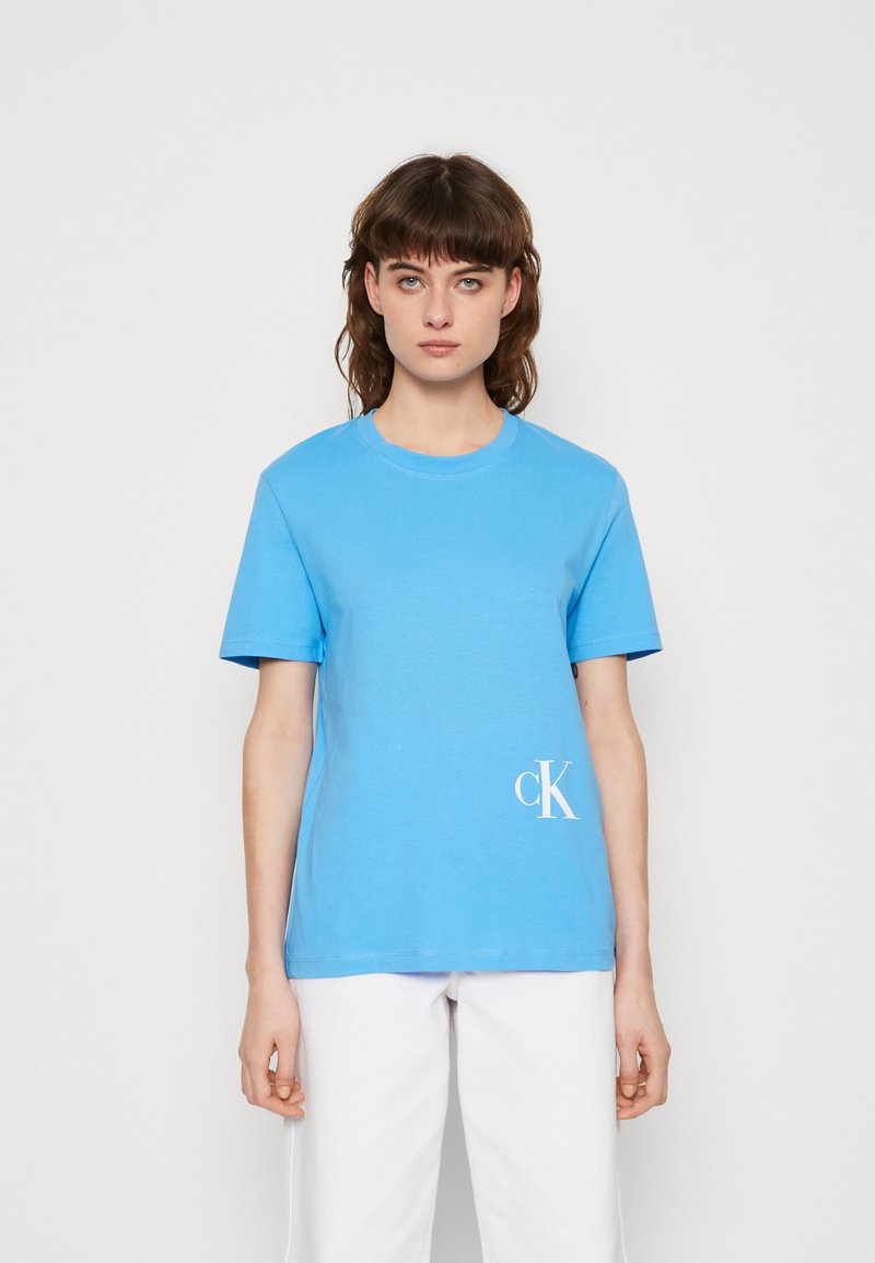 Calvin Klein Jeans COLOR OFF PLACED MONOGRAM TEE - Print T-shirt - blue ...