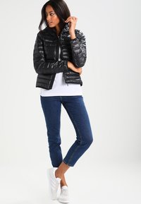 adidas Performance VARILITE - Down jacket - black - Zalando.co.uk