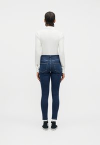 Vero Moda VMPOLLY - Jeans Skinny Fit - dark blue denim/dark-blue denim ...