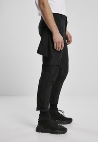 Urban Classics Cargohose - black/schwarz - Zalando.ch