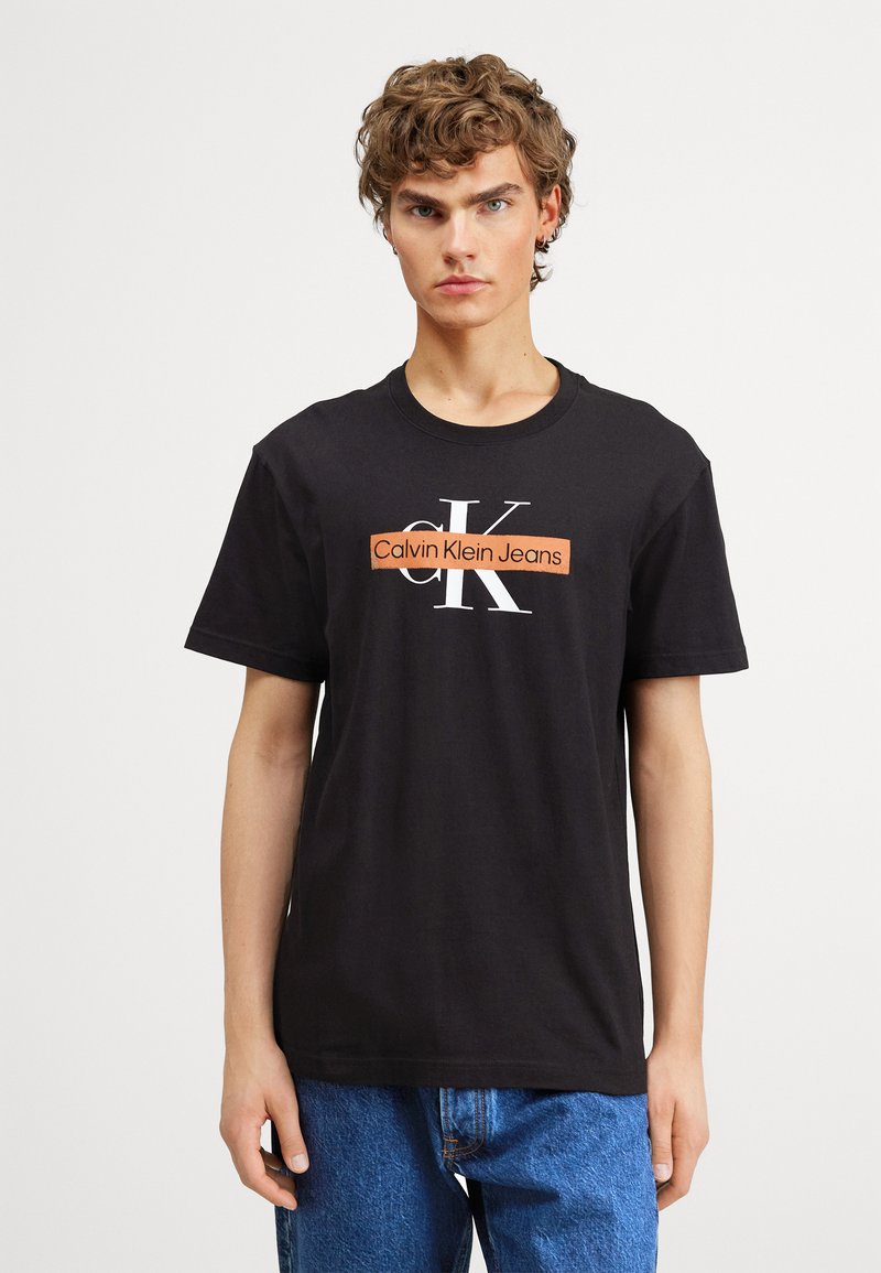 Calvin Klein Jeans UNISEX - Print T-shirt - black - Zalando.co.uk