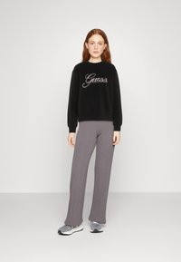 Guess SCRIPT - Sweater - jet black/zwart - Zalando.nl
