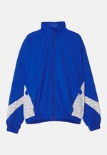 Nikolaj Storm TRACK JACKET UNISEX - Training jacket - logo blue/blue ...