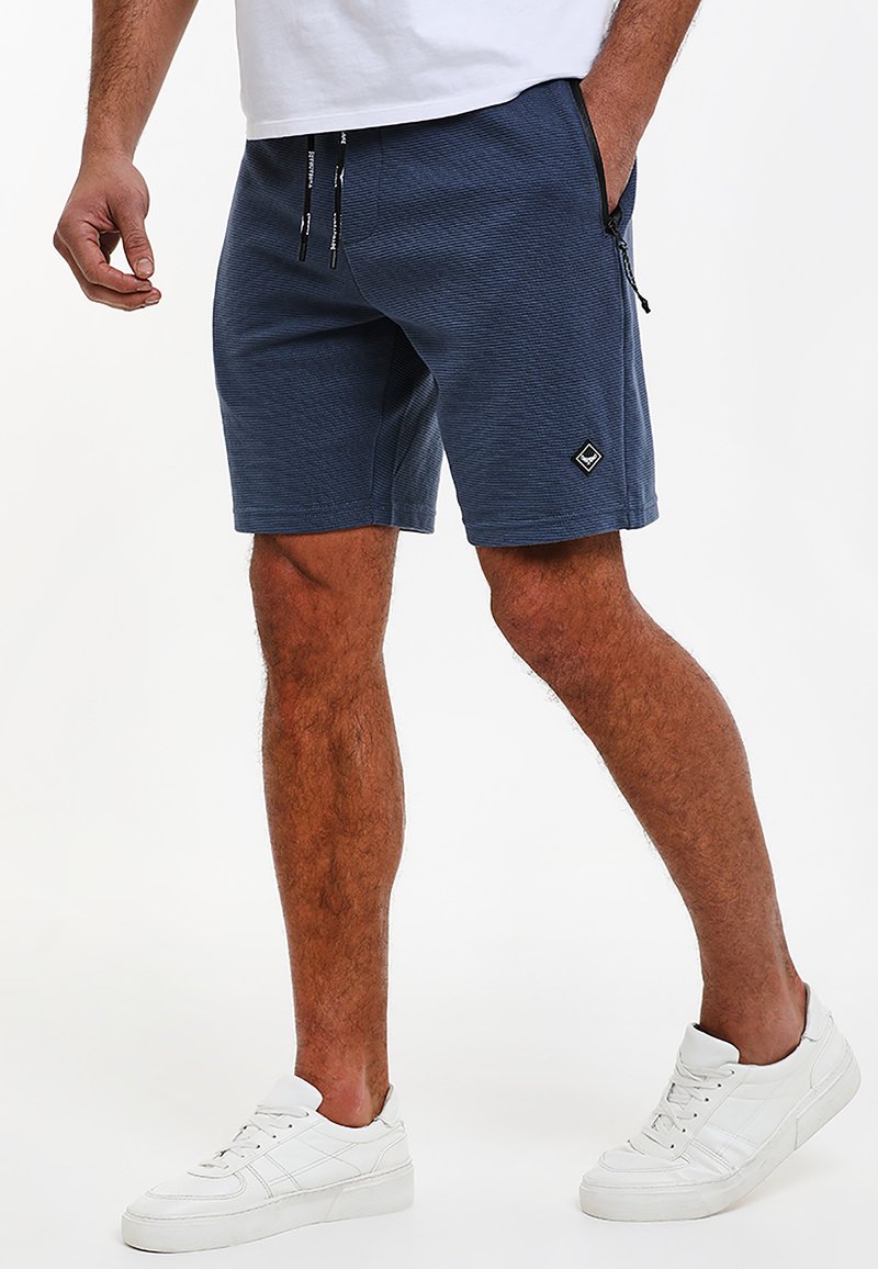 Threadbare OTTOMAN - Tracksuit bottoms - denim blue/blue denim - Zalando.ie