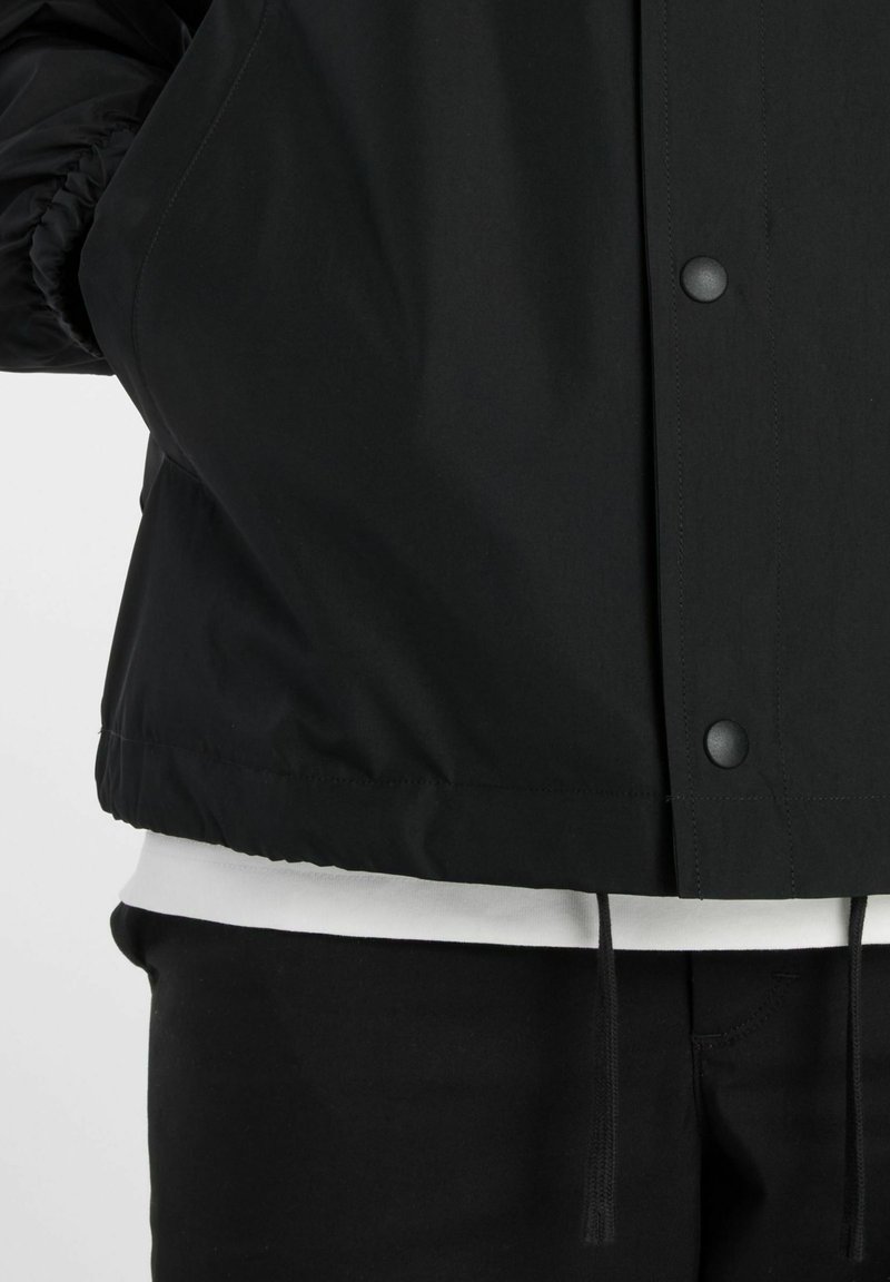 New Balance LIGHTWEIGHT COACHES - Summer jacket - black/mottled black ...