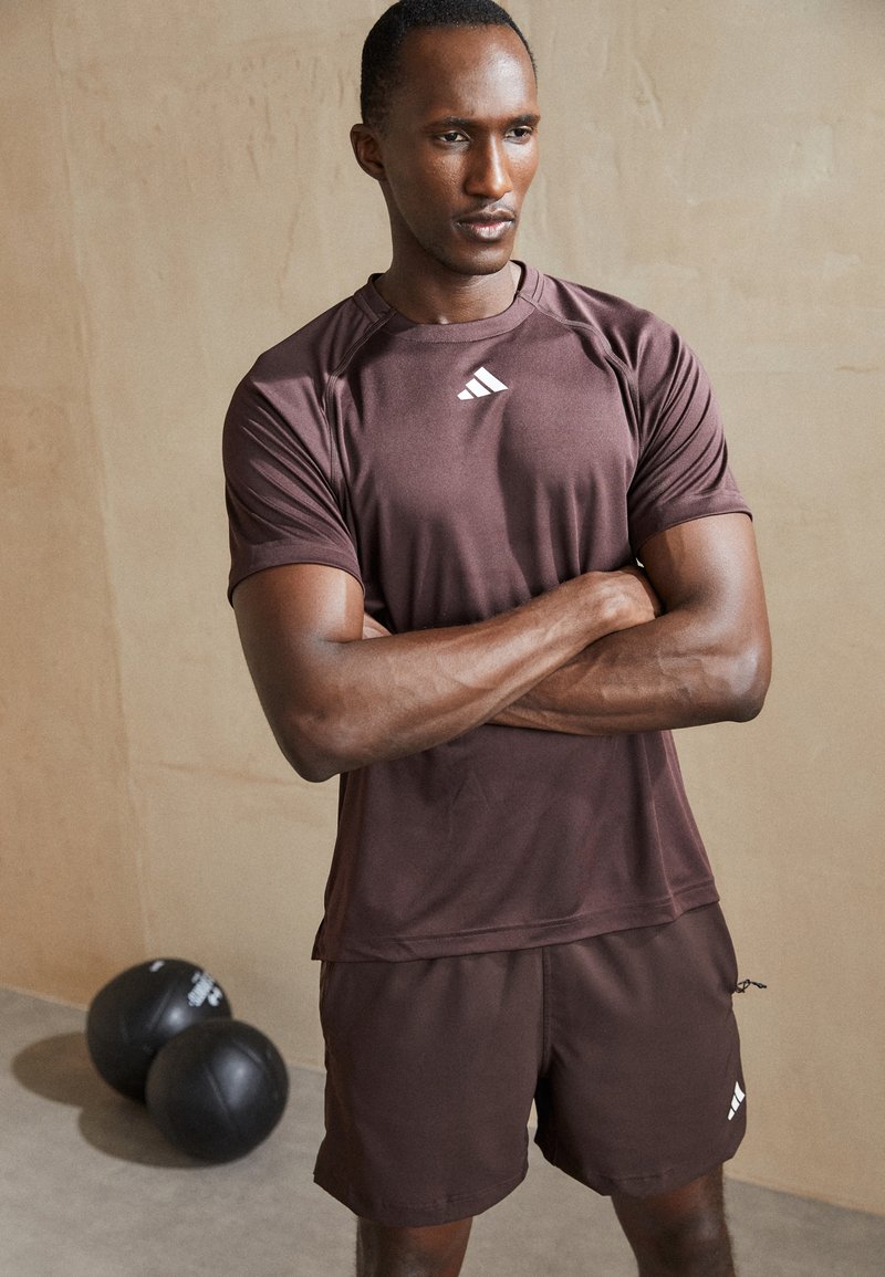 adidas Performance GYMHEAT - Sports T-shirt - shadow brown/brown ...