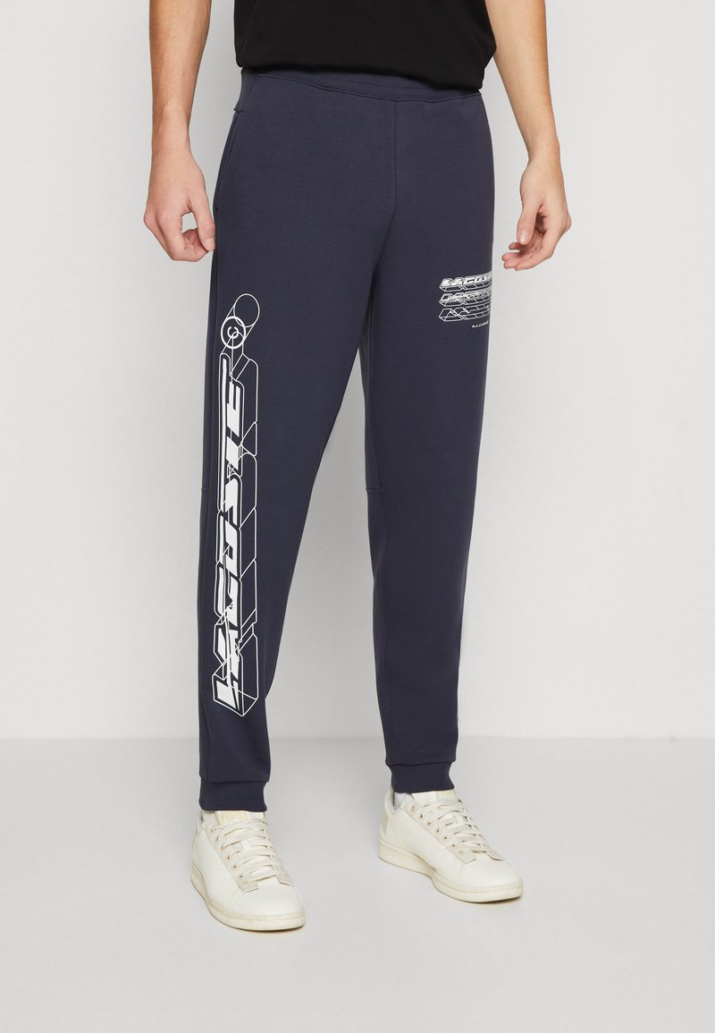 Lacoste Tracksuit bottoms - blue night/dark blue - Zalando.co.uk