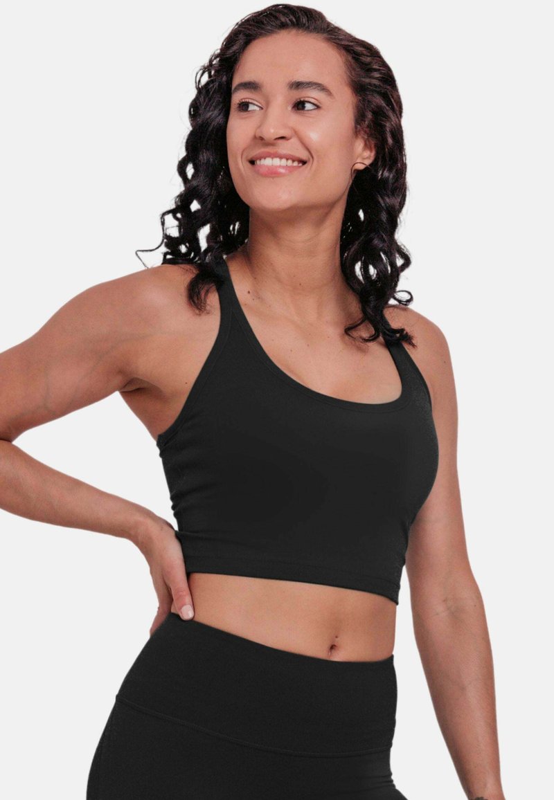 Araa Active DINE RACERBACK - Medium support sports bra - black - Zalando.ie