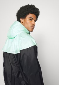 Nike Performance CHELSEA LONDON WINDRUNNER HOODED JACKET - Fanartikel - mint foam/black ...